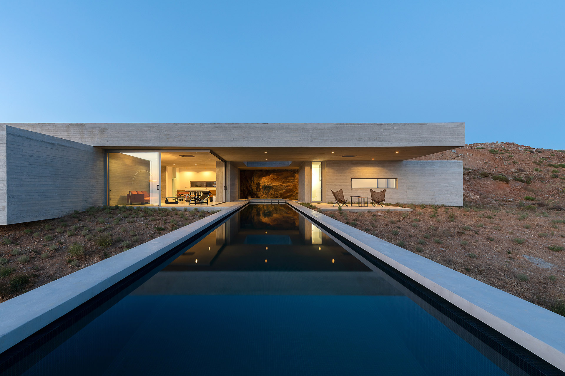 Lap Pool House: an artificial cave carved into the natural landscape of ...