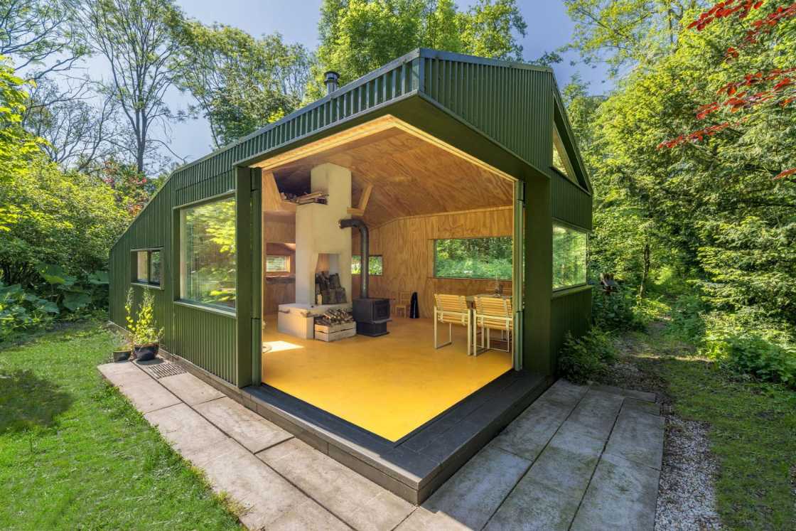 Wooden building in the Netherlands. Hidden shelter in the park