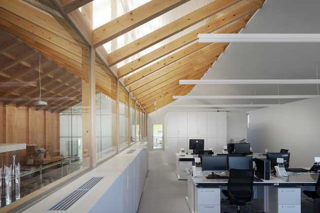 Warehouse and office for a commercial company. Wooden gable roof and ...