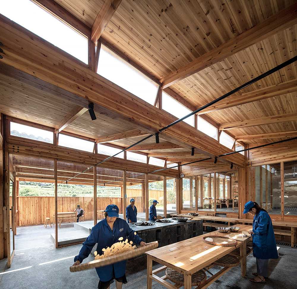 Tofu factory in a mountain village. The wooden volume rests on a long slope