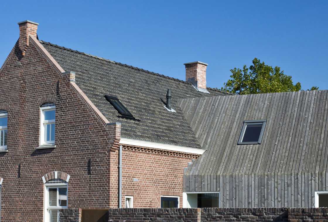 Contemporary expansion of a historic building. Wooden cladding as a ...