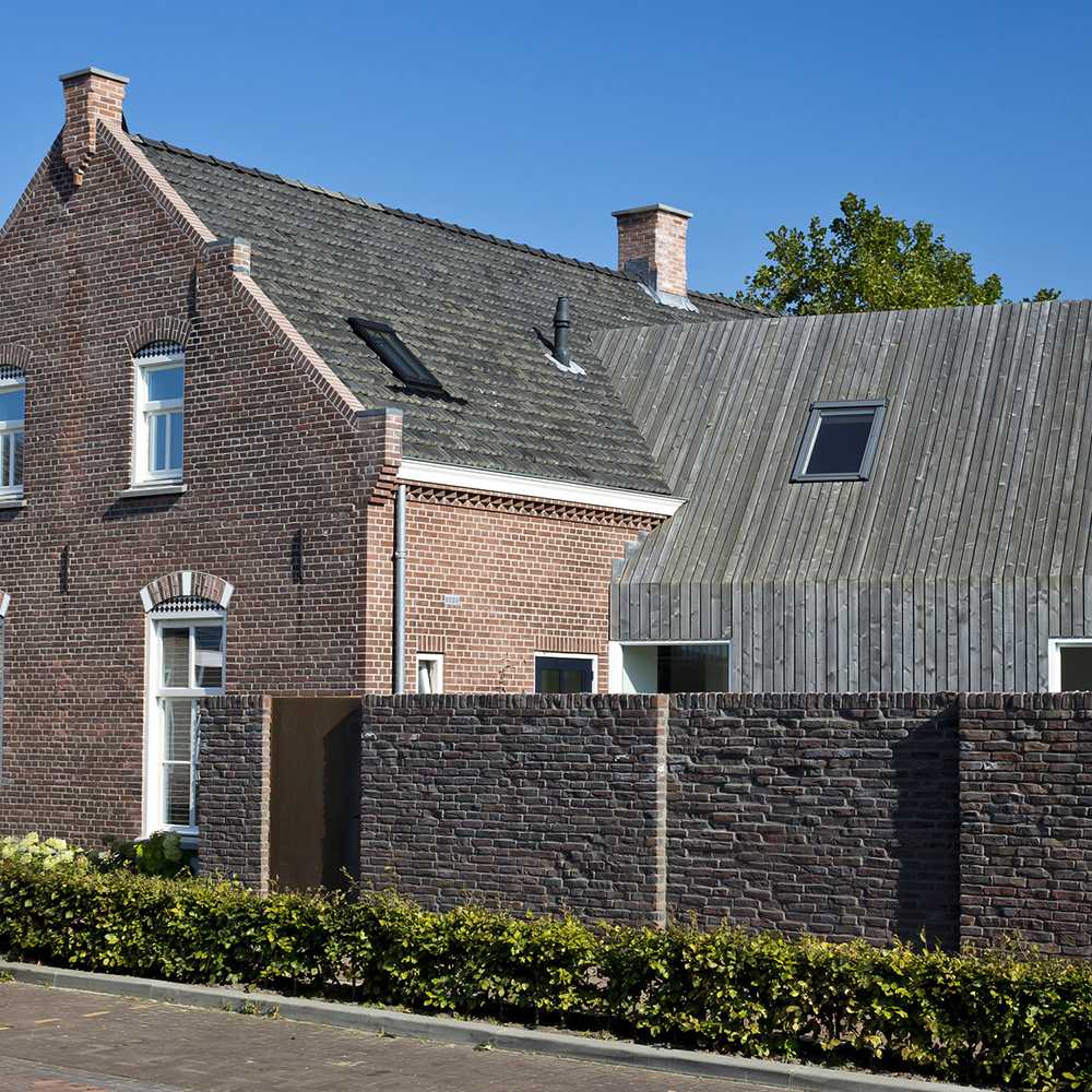 Contemporary expansion of a historic building. Wooden cladding as a ...